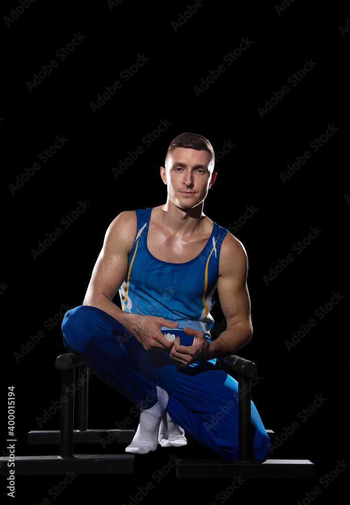 Target. Muscular male gymnast training in gym, flexible and active ...