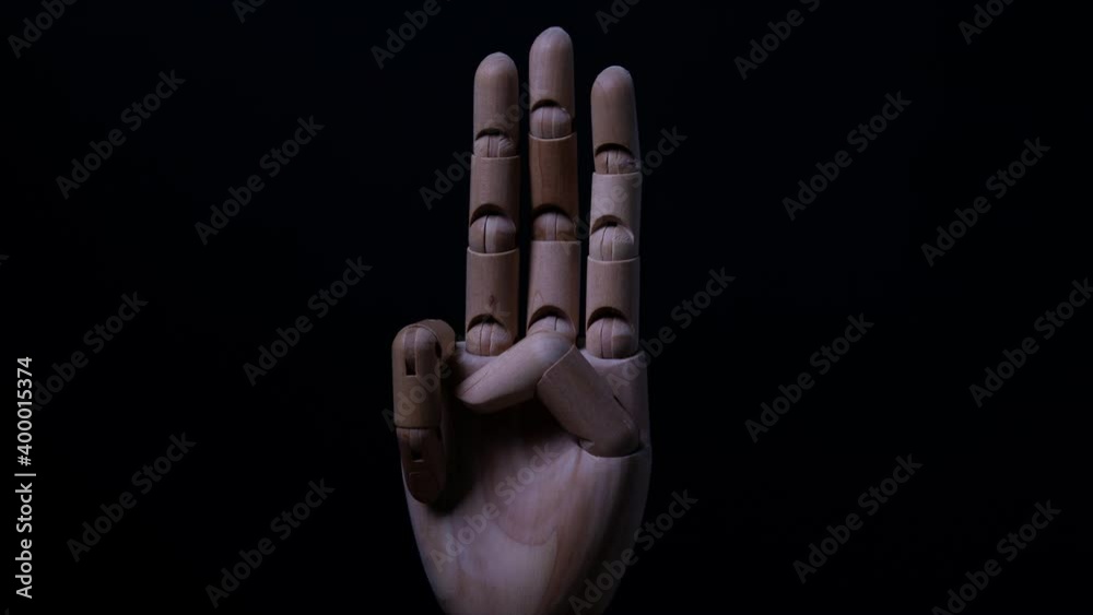 4k-Hybrid Stop motion with key frame of the hand a wooden puppet thumbs ...