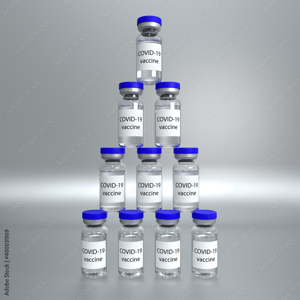 A pyramid of vials of coronavirus vaccine on a steel medical table ...