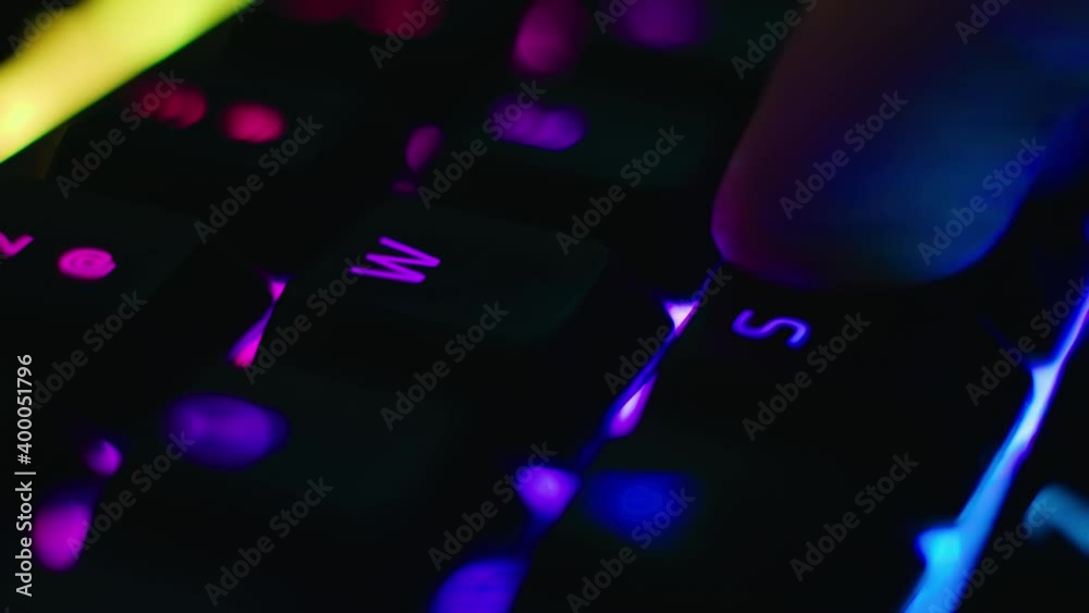 RGB keyboard in macro shoot. Tap on key Stock Video | Adobe Stock