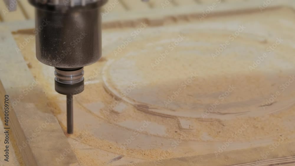 Automated cnc milling machine cutting wooden workpiece from wood pulp ...