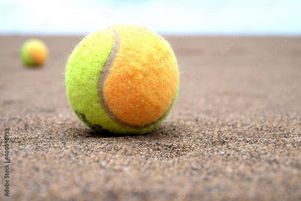 Paddle balls on the beach, selective perspective with second paddle ...