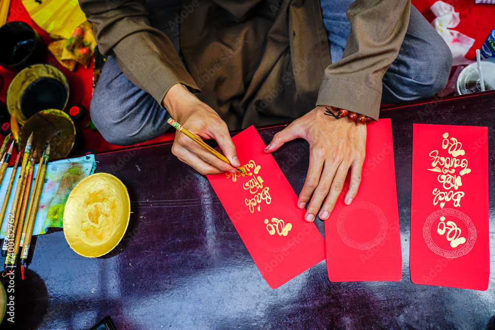 Vietnamese scholar writes calligraphy at lunar new year. Calligraphy ...
