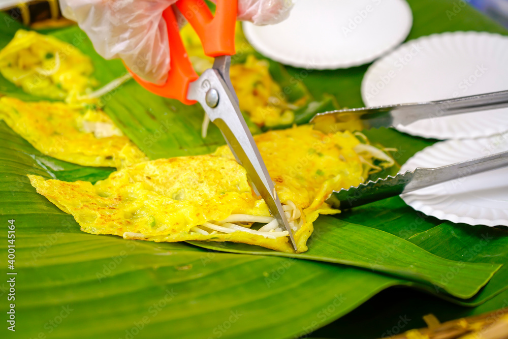 Banh xeo, Vietnamese traditional street food yellow crispy rice flour ...