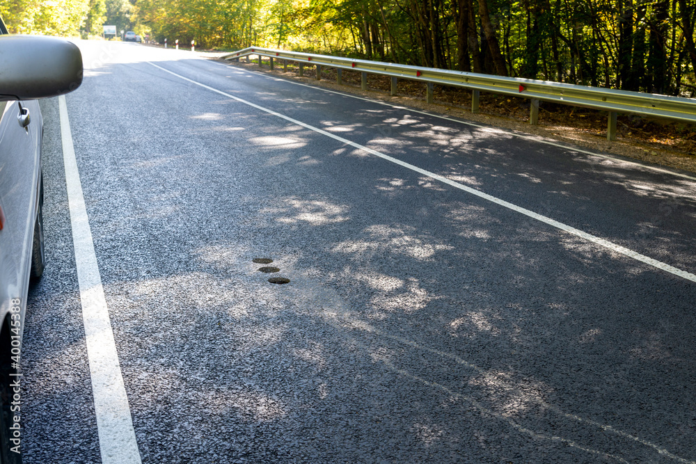 Holes in asphalt pavement, drilled cylindrical specimen for laboratory ...