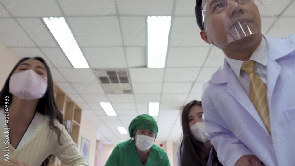 Group Professional Asian doctor with surgeon and patient relative ...