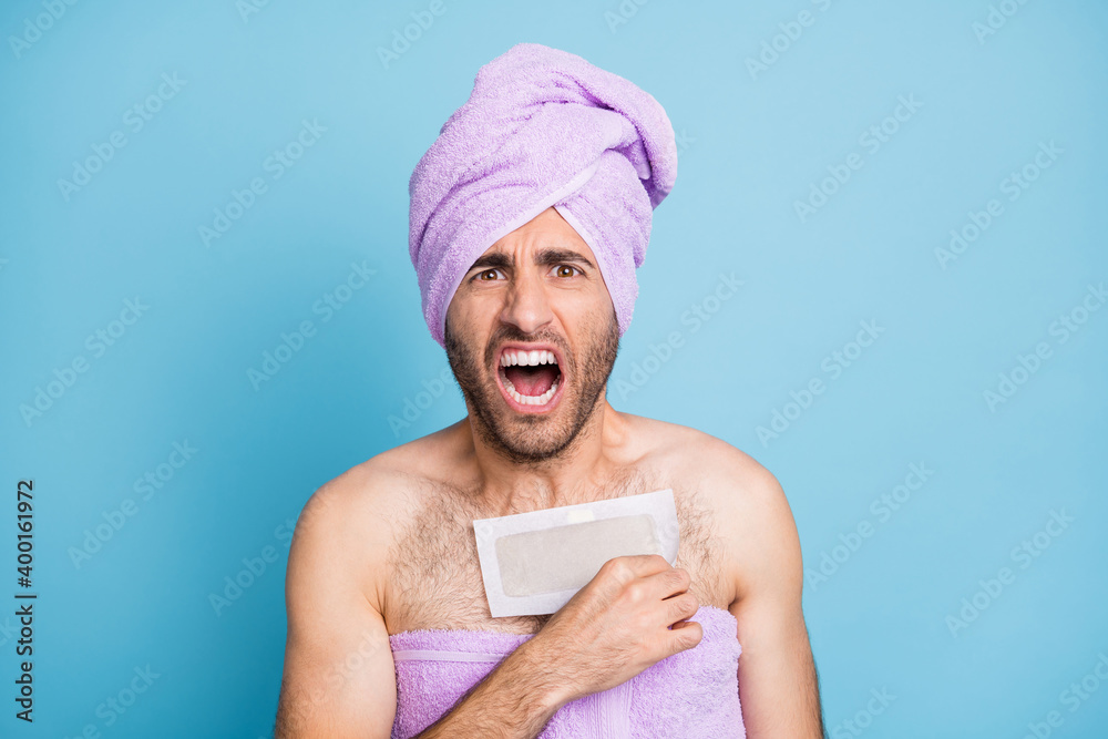 Portrait of devastated guy wear turban towel making epilation pulling ...