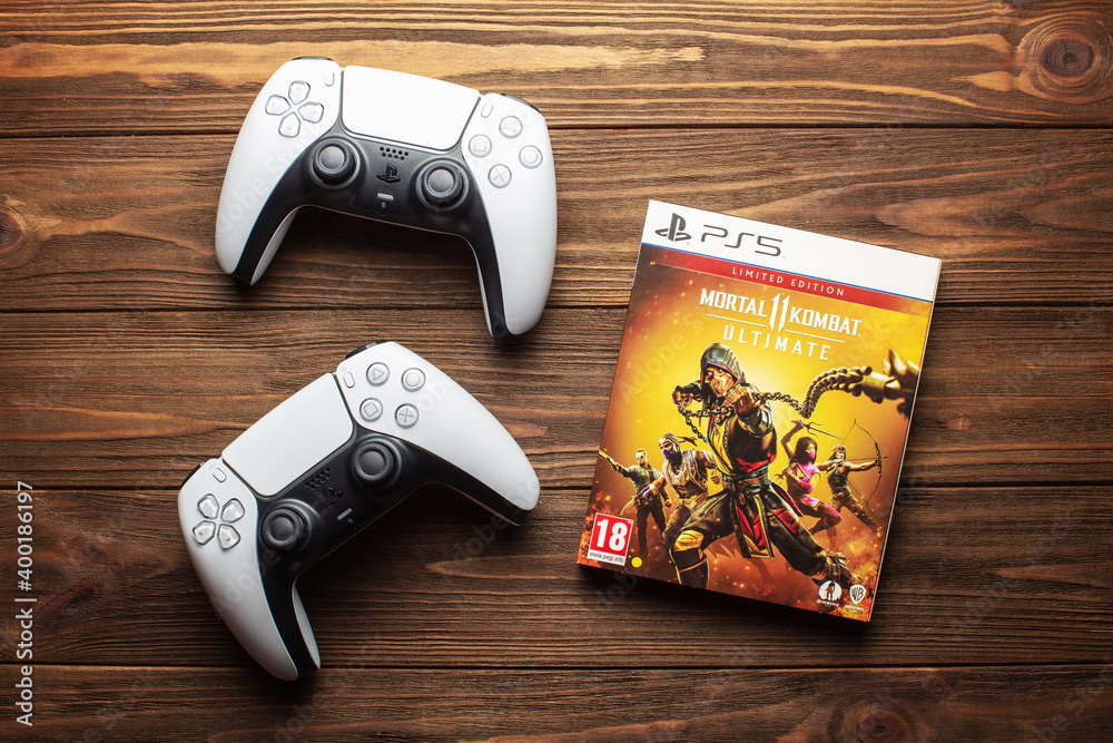 Two dualsense ps5 controllers and mortal kombat game Stock Photo ...