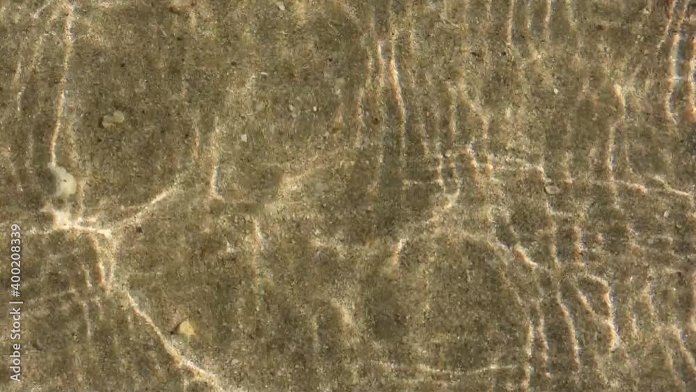 Abstract textures of sea water and sand. Light beige iridescent natural ...