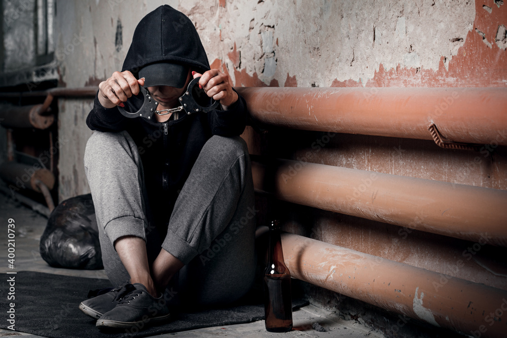 The concept of drug addiction and homelessness. A depressed and ...