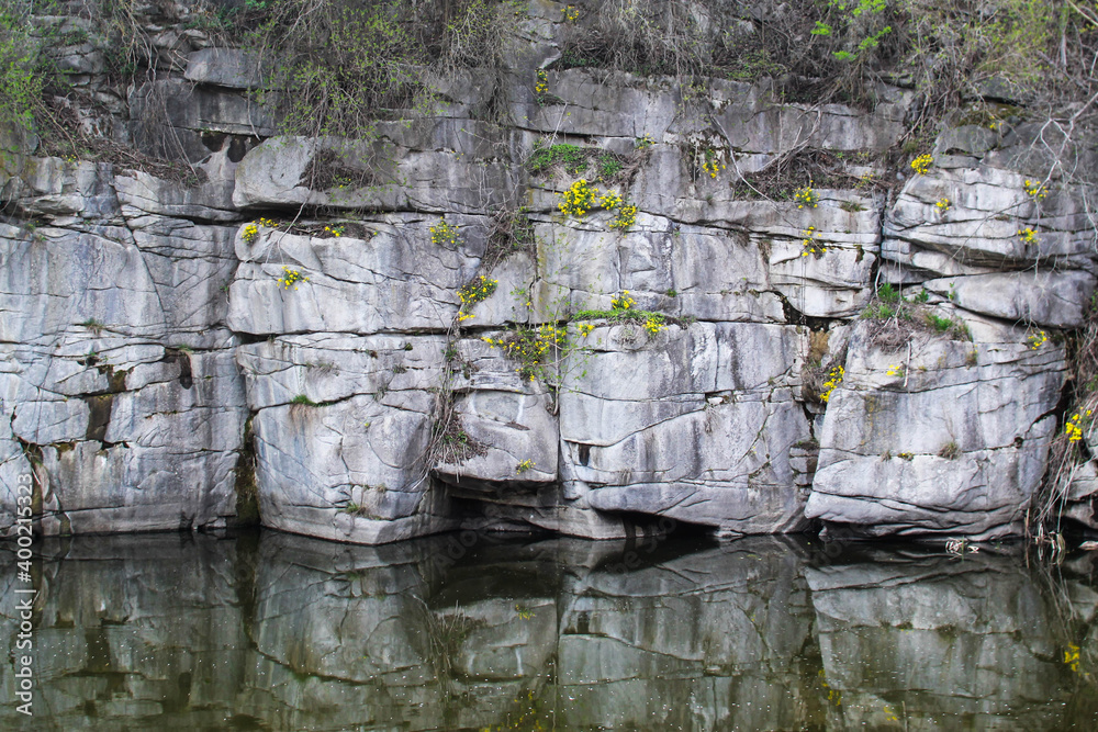 Large strong rocks are located above the water Stock Photo | Adobe Stock