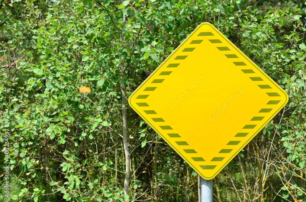 Empty yellow road sign on forest background. The yellow background on ...
