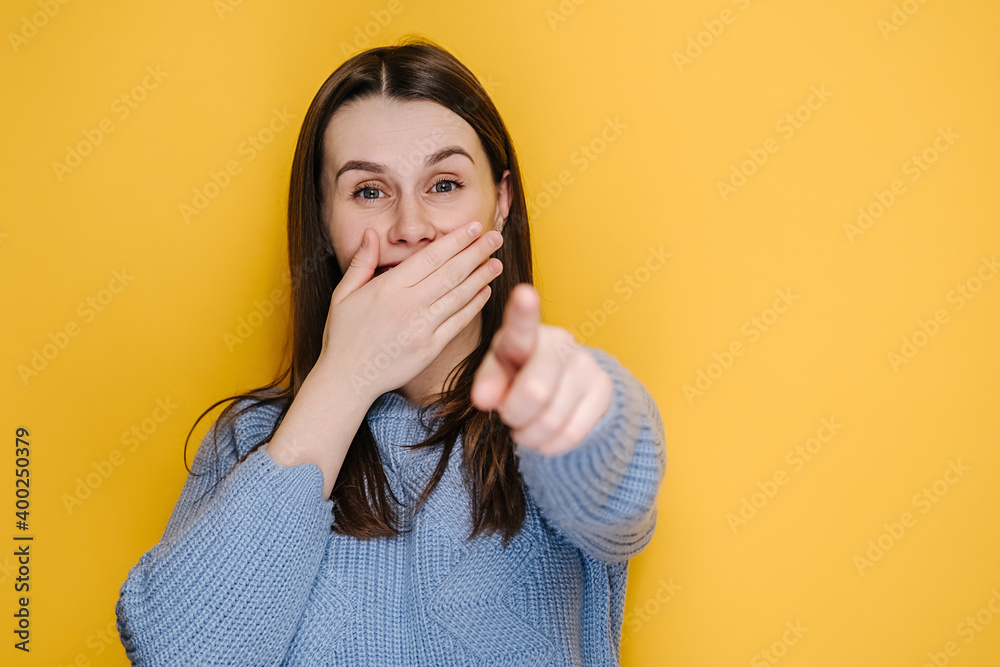 Amused happy millennial young female isolated on yellow studio ...