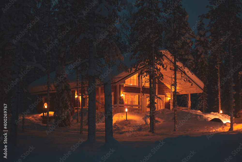 A night view of cozy wooden scandinavian cabin cottage chalet house ...