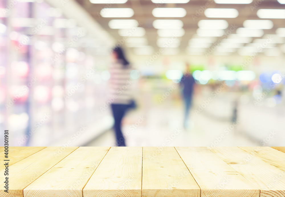 Supermarket or retail store blur abstract background include wood table ...