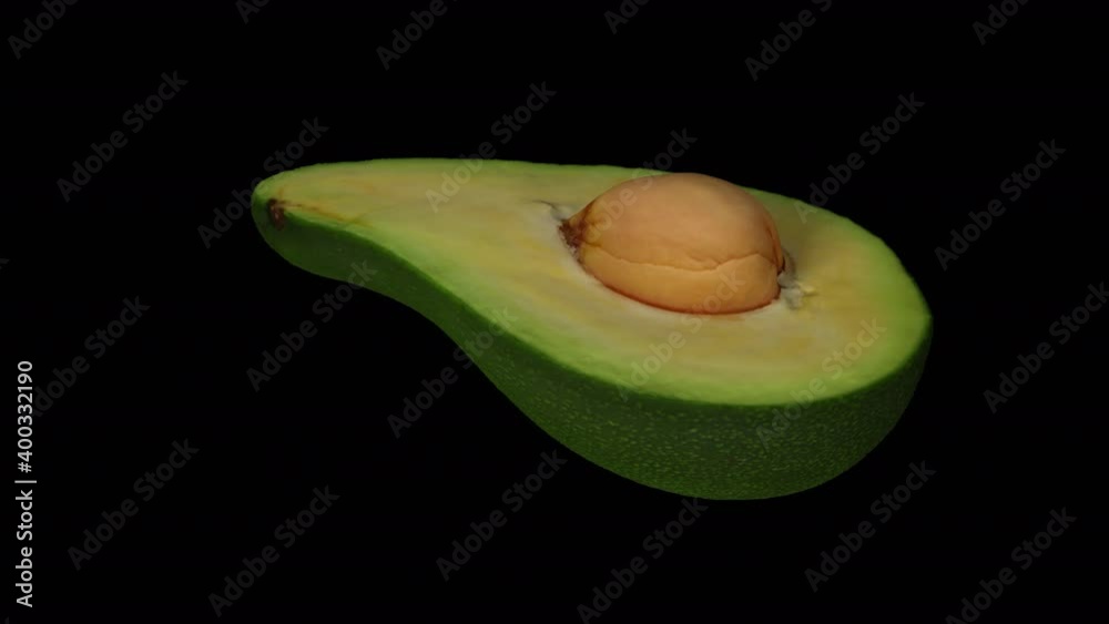 Vidéo Stock Realistic render of a rotating green Florida avocado (cut ...