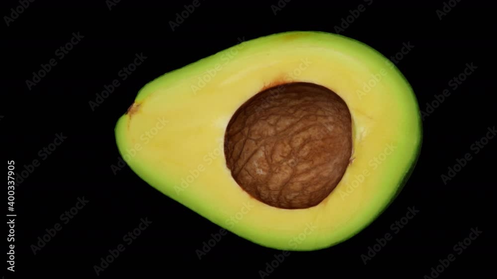 Realistic render of a rotating green Florida avocado (cut in half) on ...