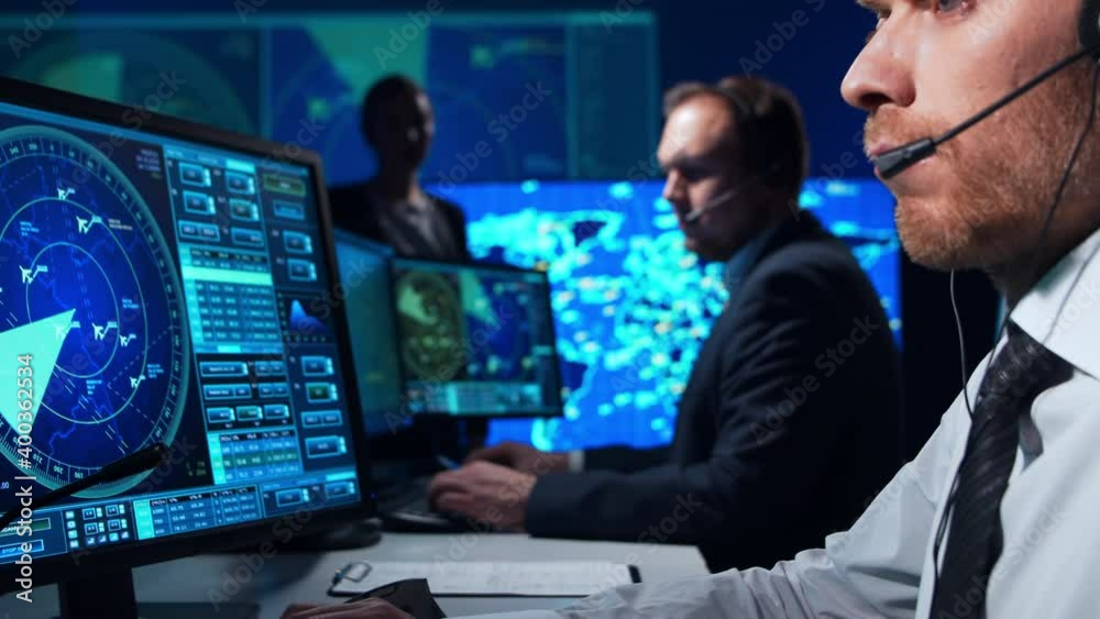 Workplace of the air traffic controllers in the control tower. Team of ...