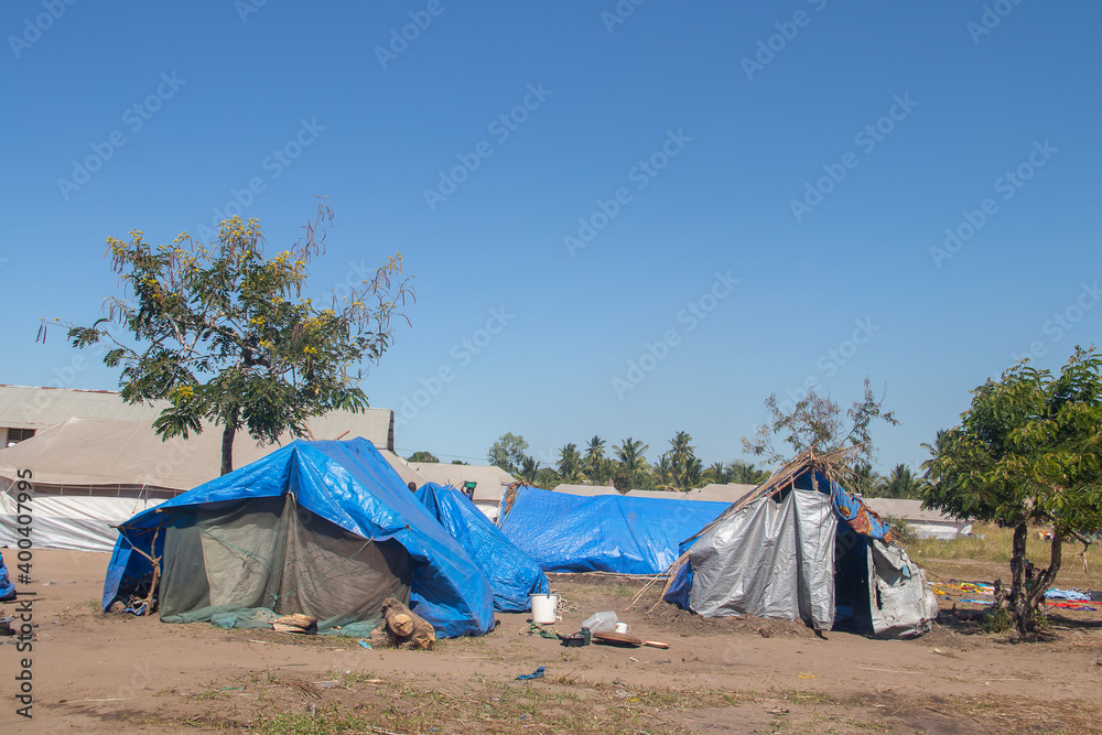 Refugee camp made of tents, people living in very poor conditions, lack ...