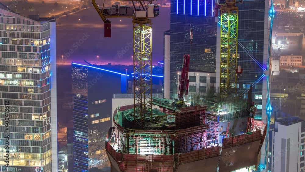 Vidéo Stock Skyline with Skyscrapers and construction process night ...