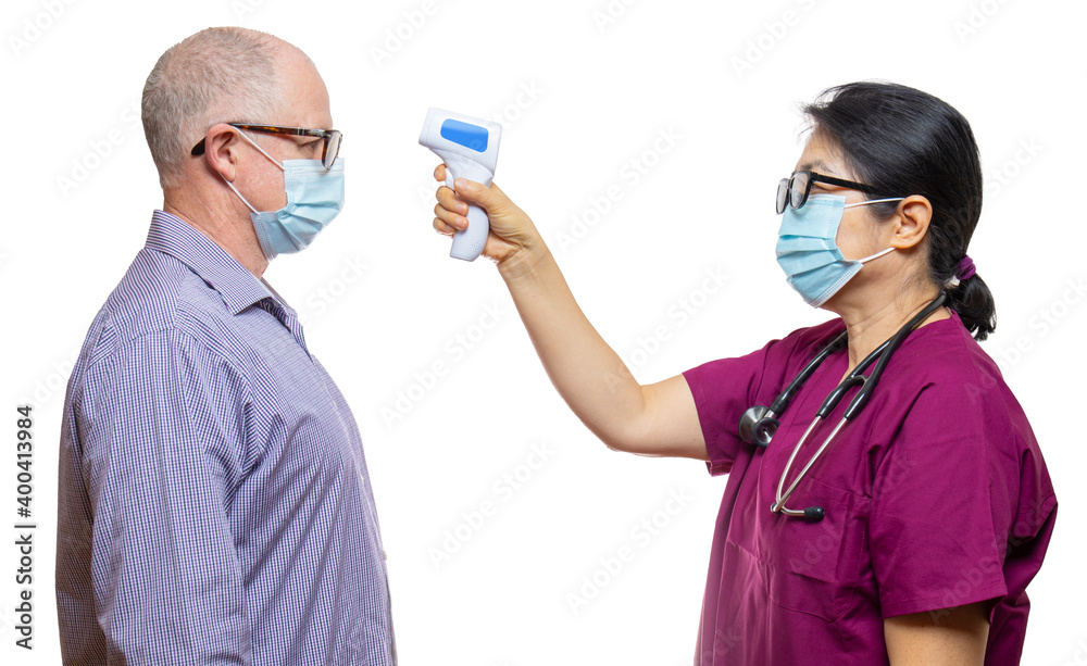 nurse checking patients temperture with infrared thermometer against a ...