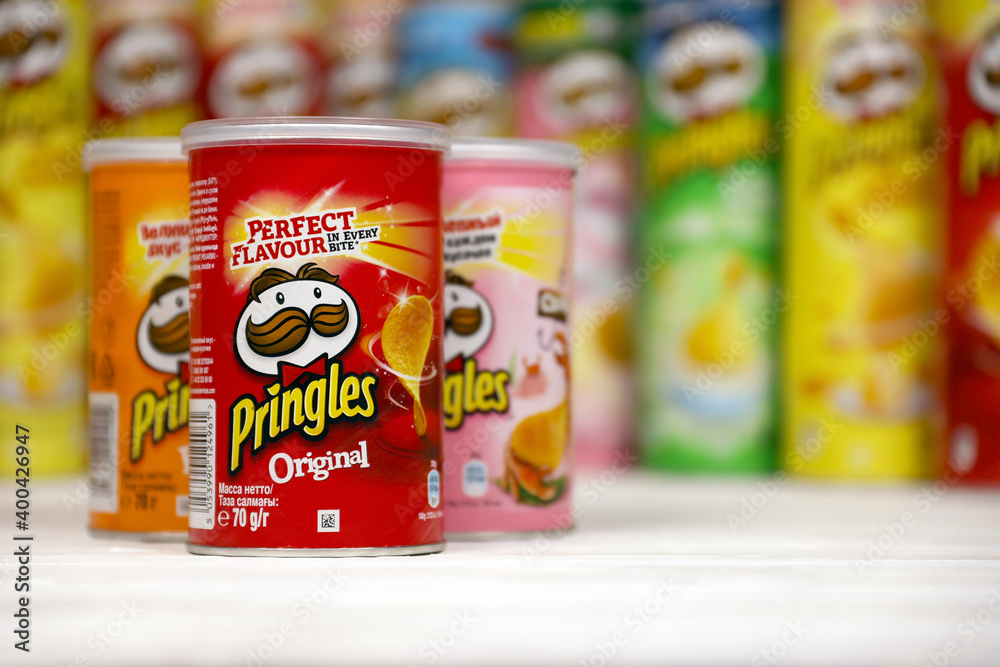Pringles variety of flavors. Many cardboard tube cans with Pringles ...