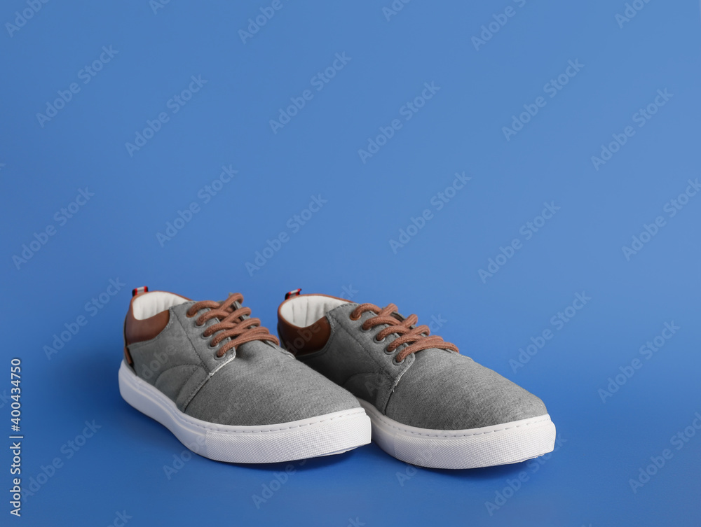 Casual male shoes on color background Stock Photo | Adobe Stock