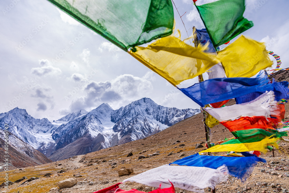 Colorful prayer flags flying in winds with Himalayas mountains at ...
