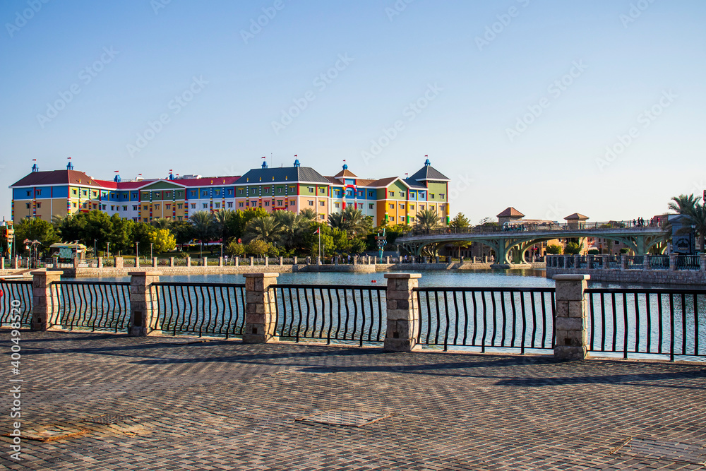 Colorful multi storey building on the lake at Dubai parks and resorts ...