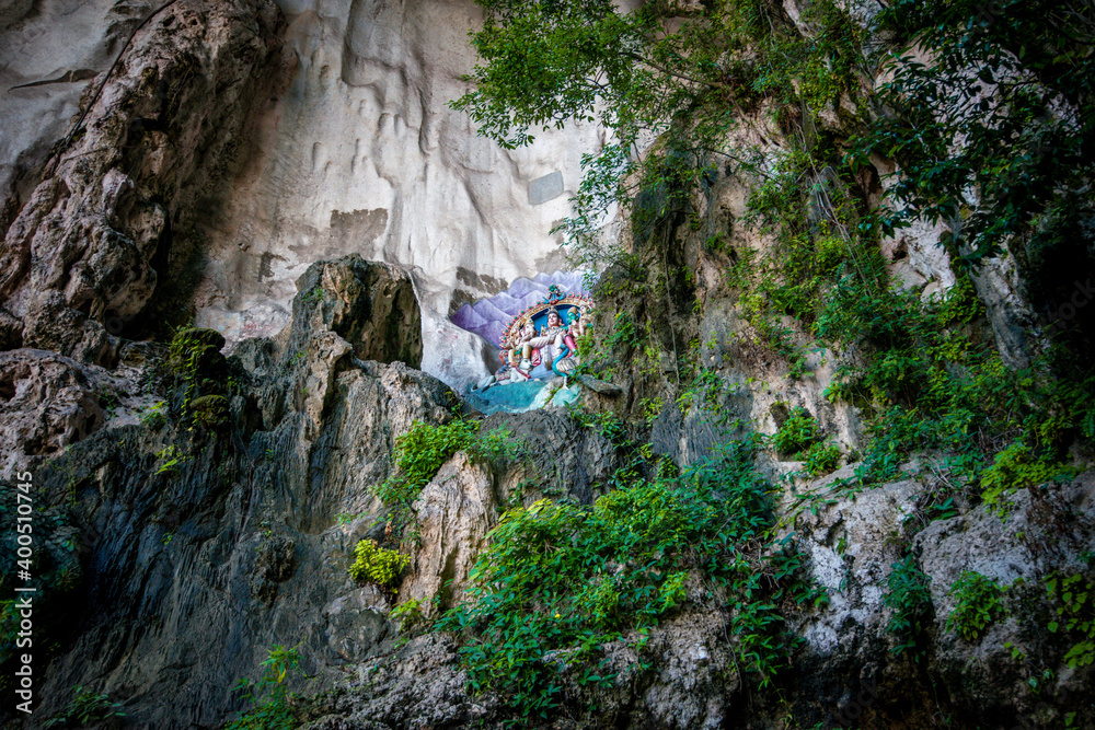 The famous and iconic limestone with rainbow colored stairs at Murugan ...