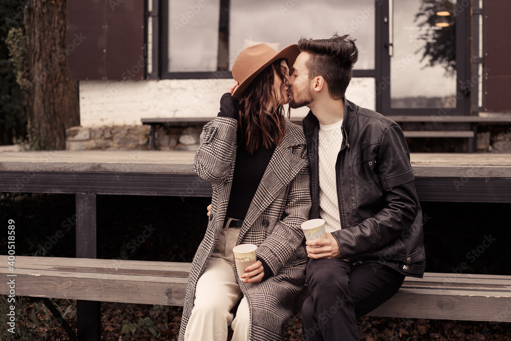 Heterosexual satisfied married couple have a date outside near cafe on ...