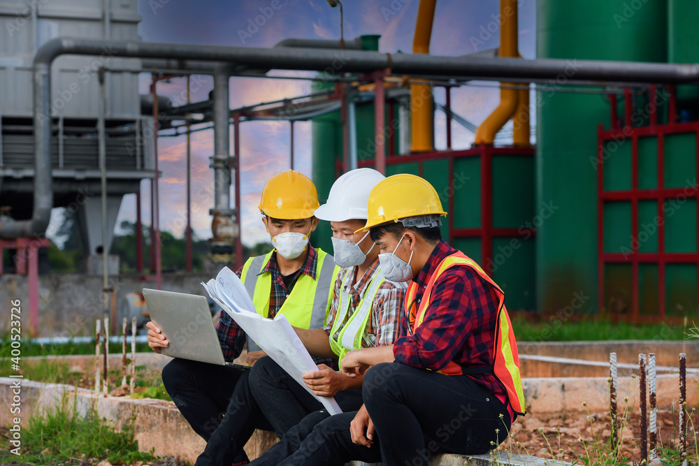 engineer discusses technical documentation with his help in the ...