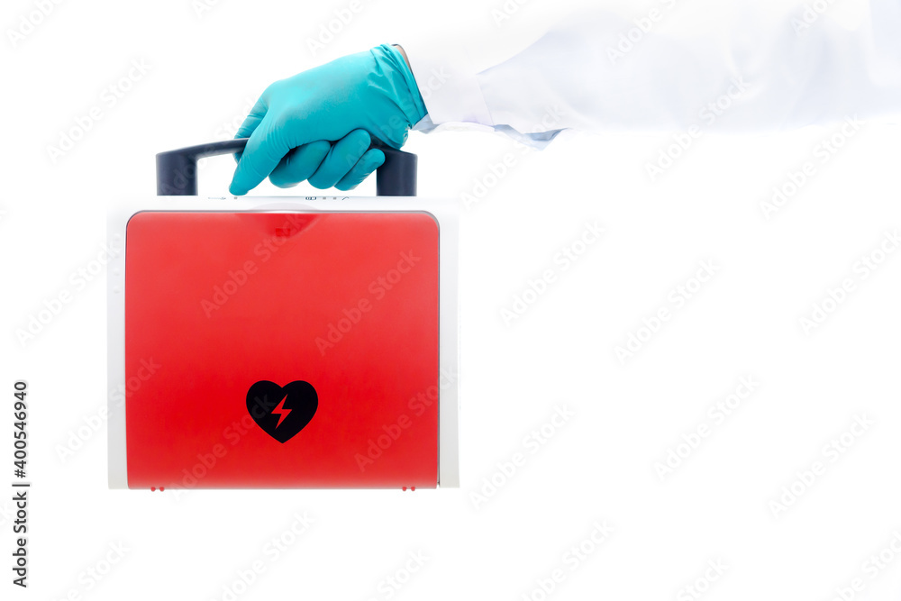 Aed rescue equipment Or a red heart defibrillator In the doctor's hand ...