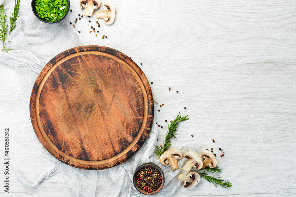Food background. Kitchen board on the table with spices and herbs. Top ...