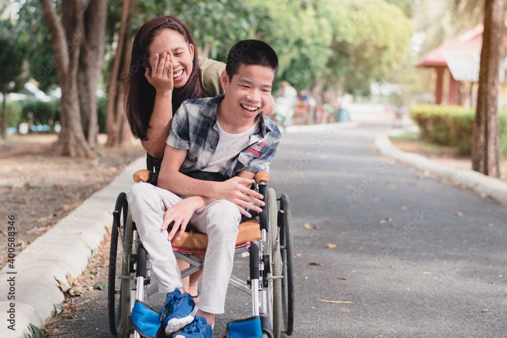 Disabled child on wheelchair is playing, learning and exercise in the ...