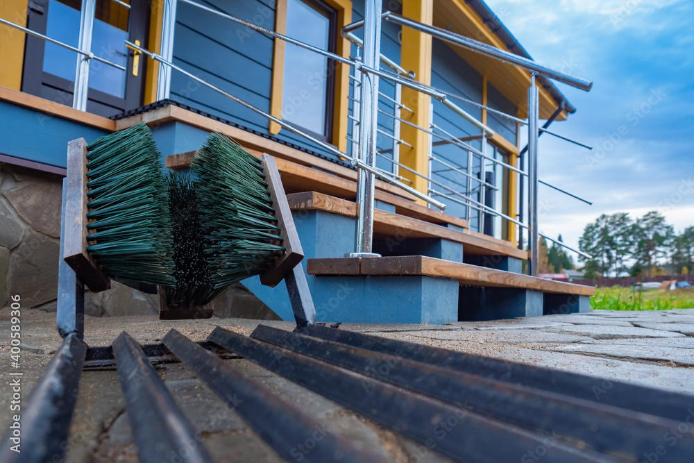 Shoe cleaning before entering the house. Cottage with a porch and Shoe ...