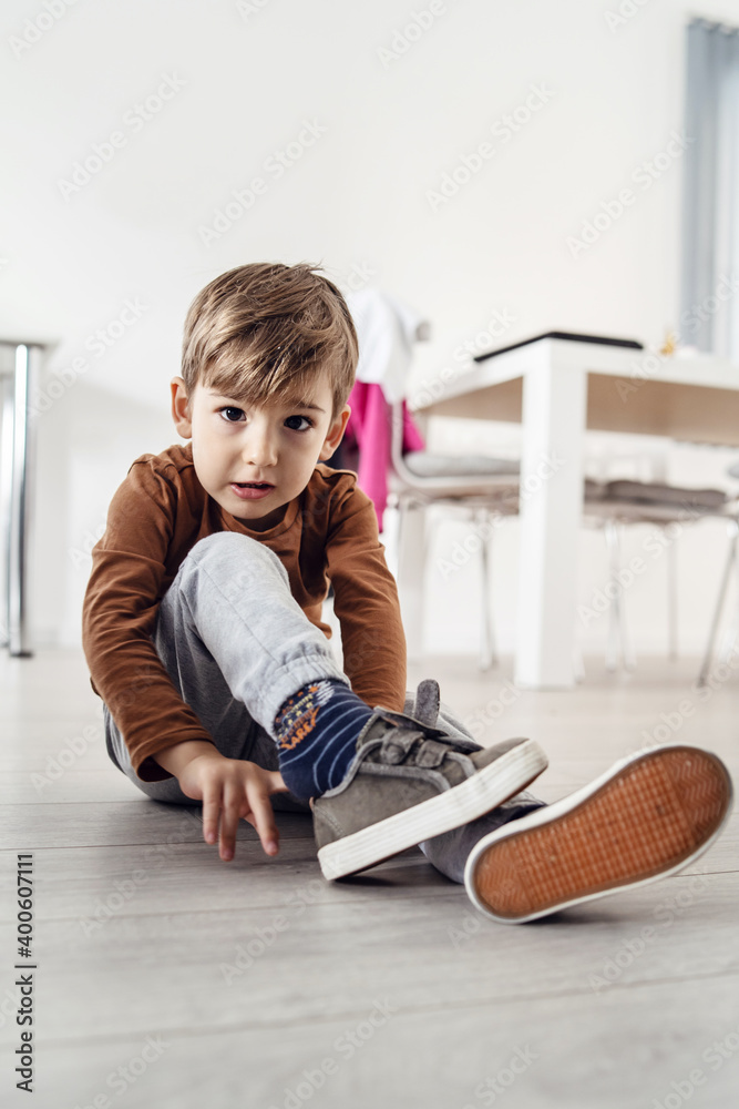 Full length view of small cute caucasian boy little child kid sitting ...