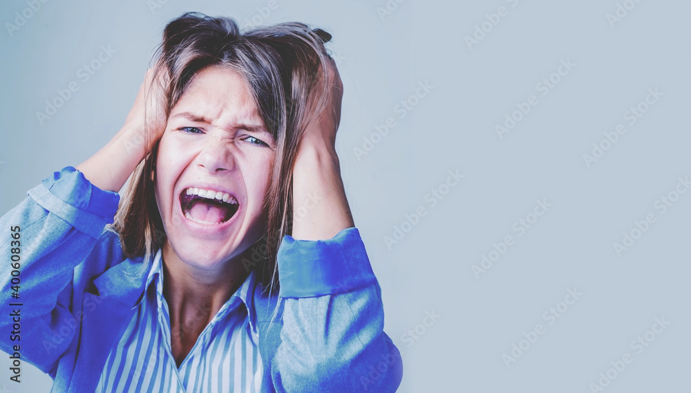 Exhauste woman screaming from unbearable office work. Copy space for ...