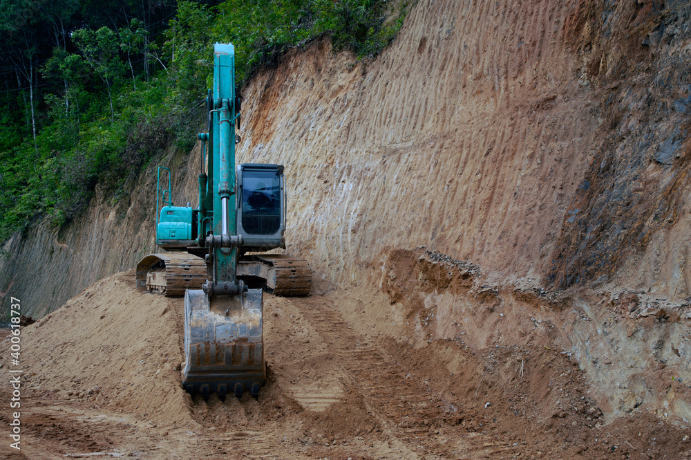 Excavator during excavation at construction site. Excavator digging ...