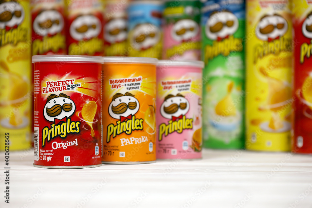 Pringles variety of flavors. Many cardboard tube cans with Pringles ...