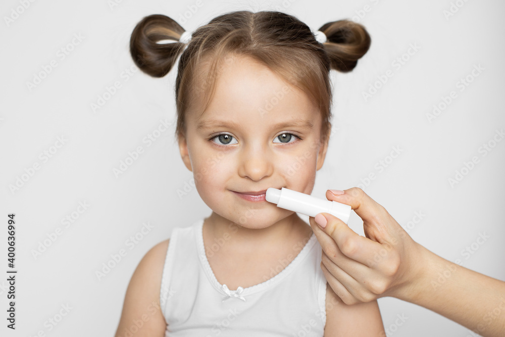 Lips hygiene and care. Sunscreen, wind and frost protection of kids ...