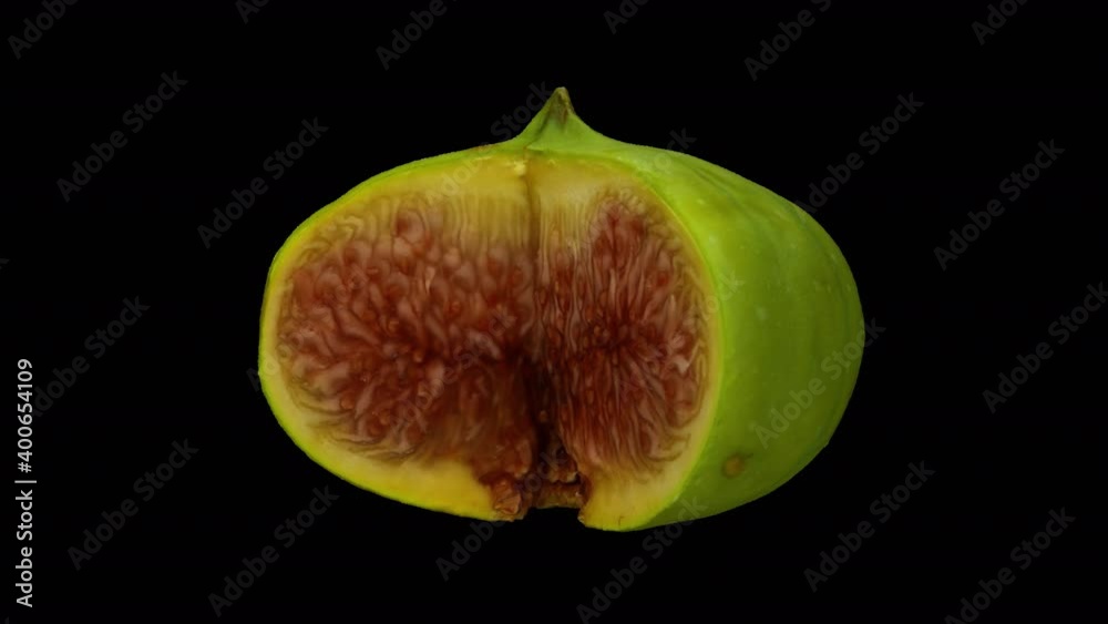 Realistic render of a rotating half green calimyrna fig on transparent ...