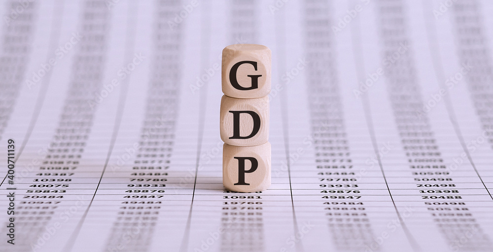 GDP word written on wood block on the chart background . Stock Photo | Adobe Stock