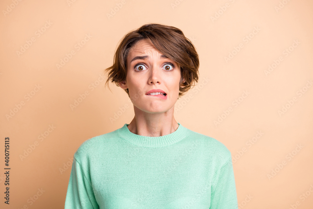 Portrait of young beautiful scared afraid frightened girl bite lips ...