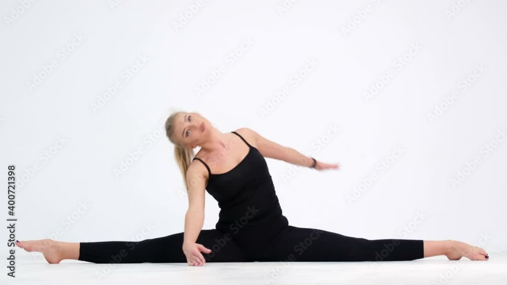 Blonde bent female jazz dancer performance with arms swinging in s ...