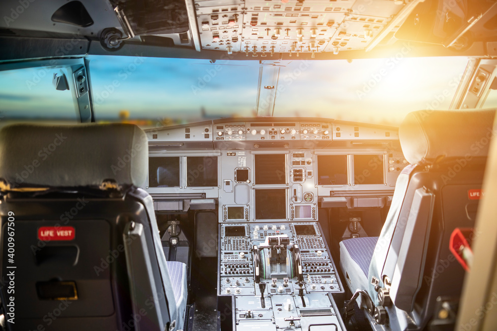 Aircraft interior, cockpit view inside the airliner. Sunny sky horizon ...