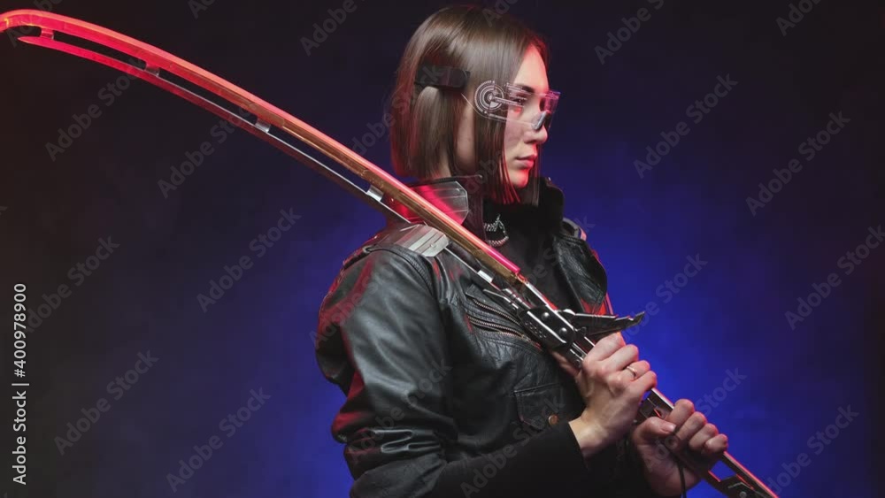 Dangerous female assassin from the future in cyberpunk style armed with ...