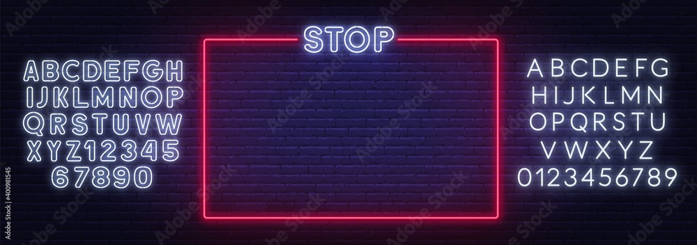 Neon stop sign in a frame on brick wall background. White neon ...
