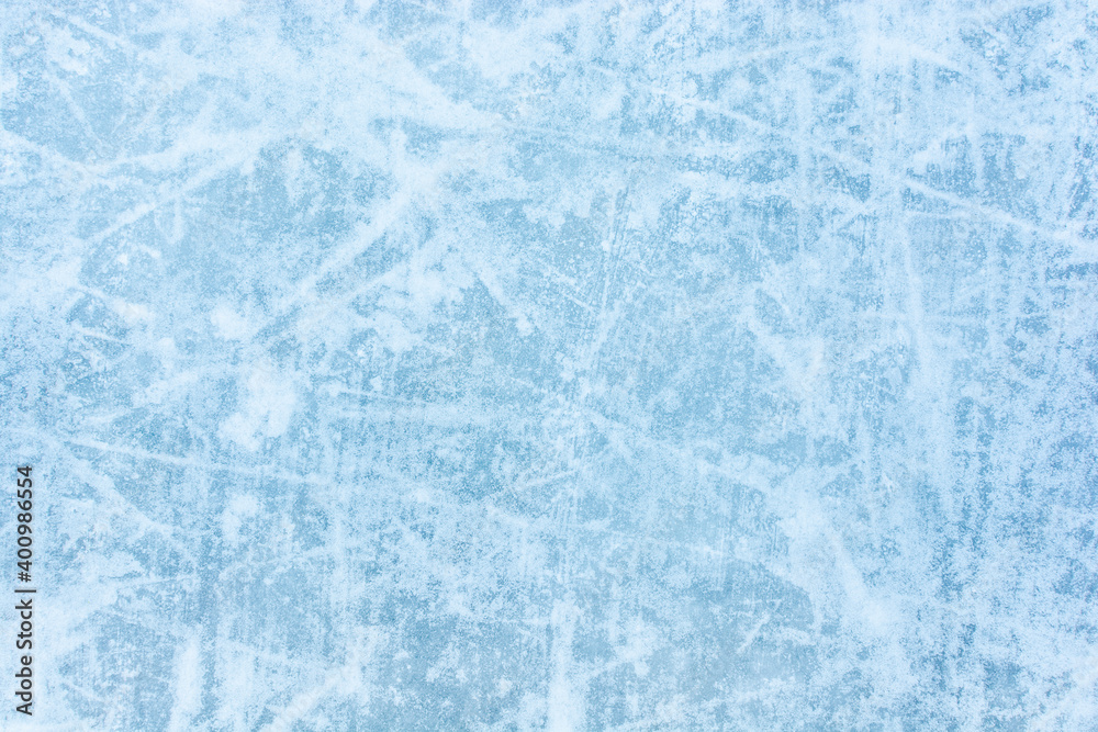 Ice blue background with skate tracks. Frozen water, sea. Frosty ice ...