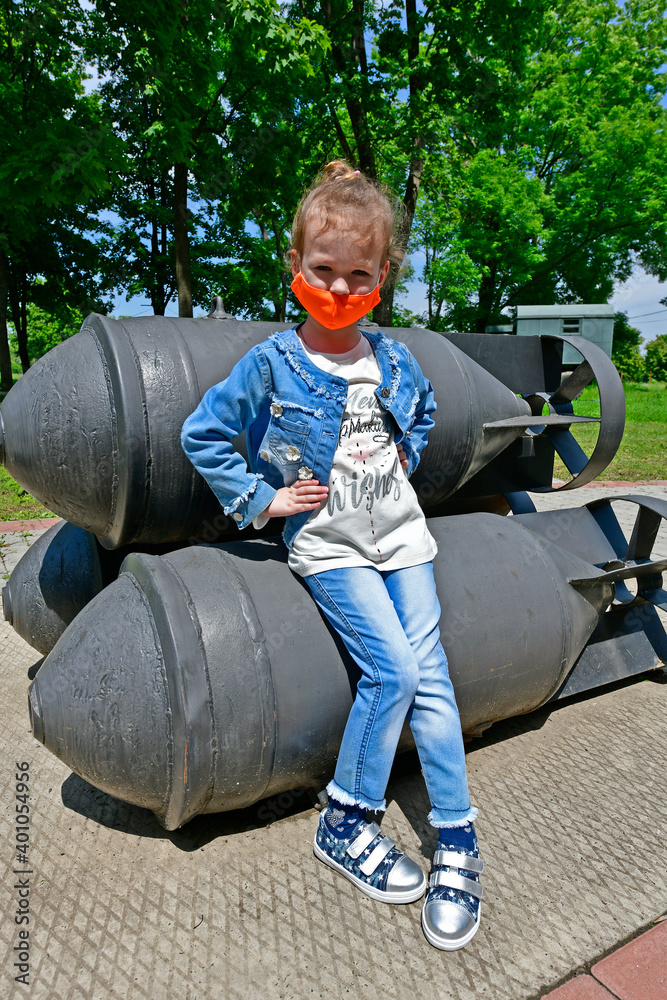 Little girl child walks through the military museum. Stock Photo ...